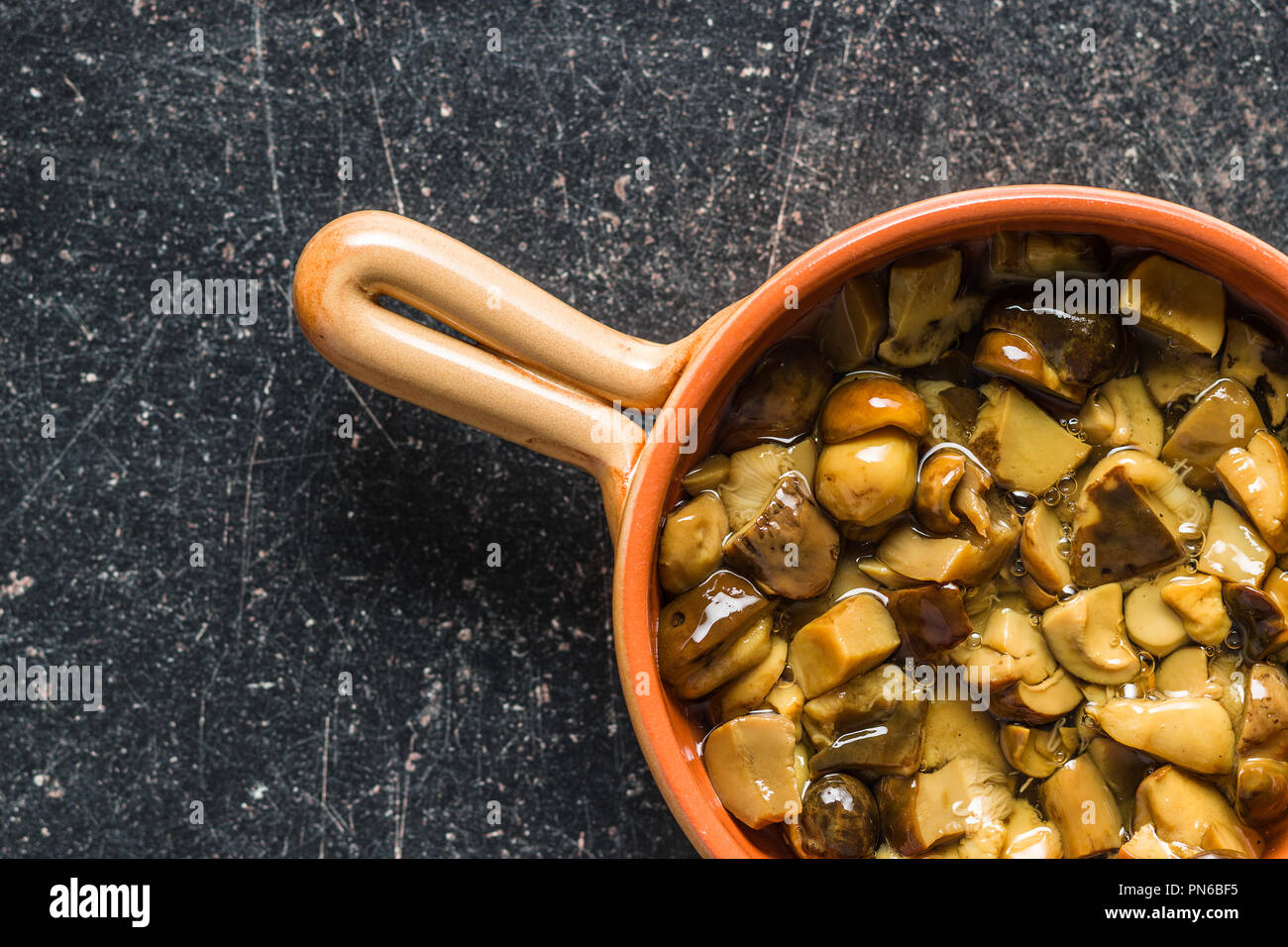 Pickled mushrooms. Marinated boletus in bowl Stock Photo - Alamy