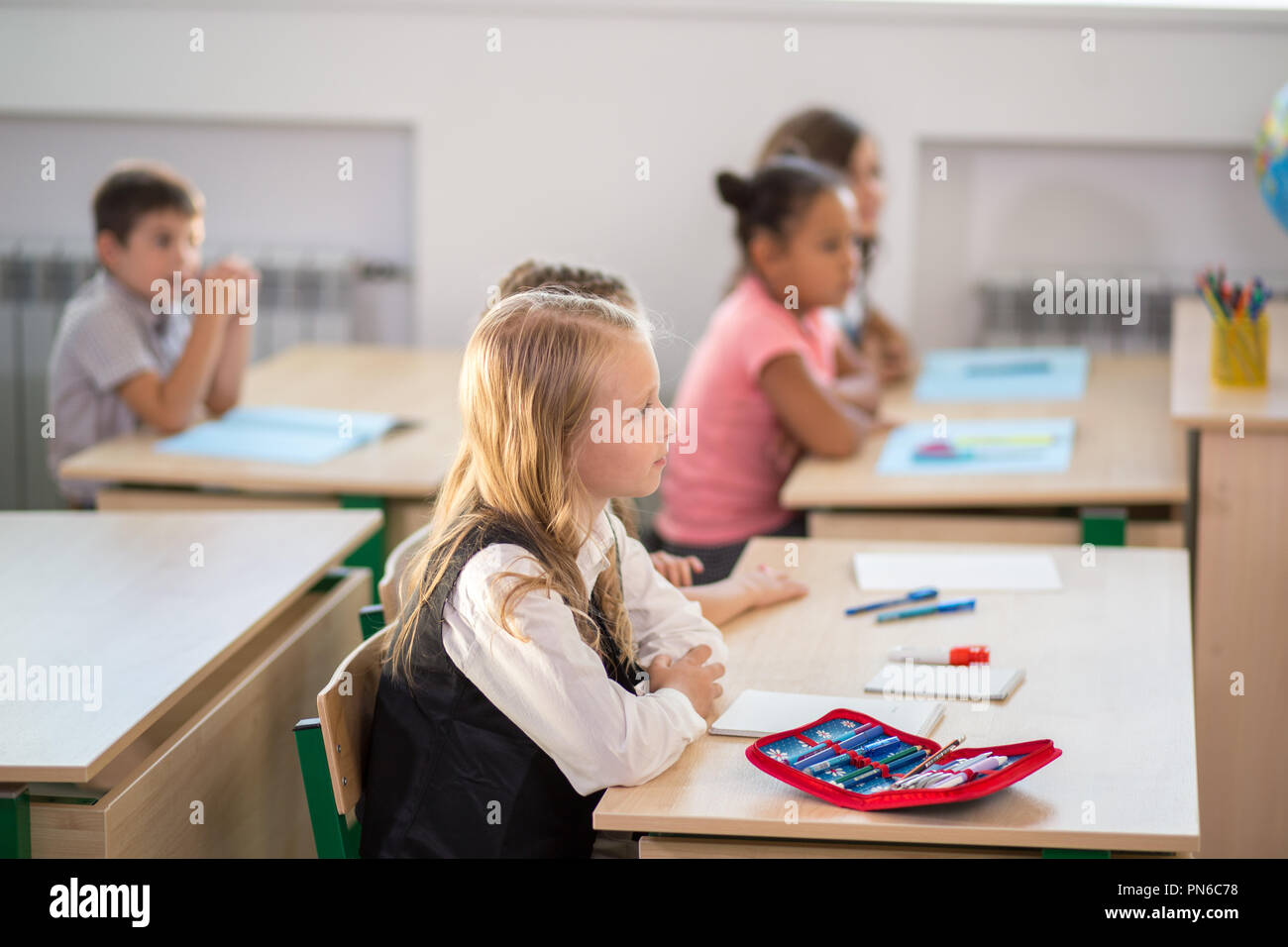 school children participating actively in class. Education, learning ...