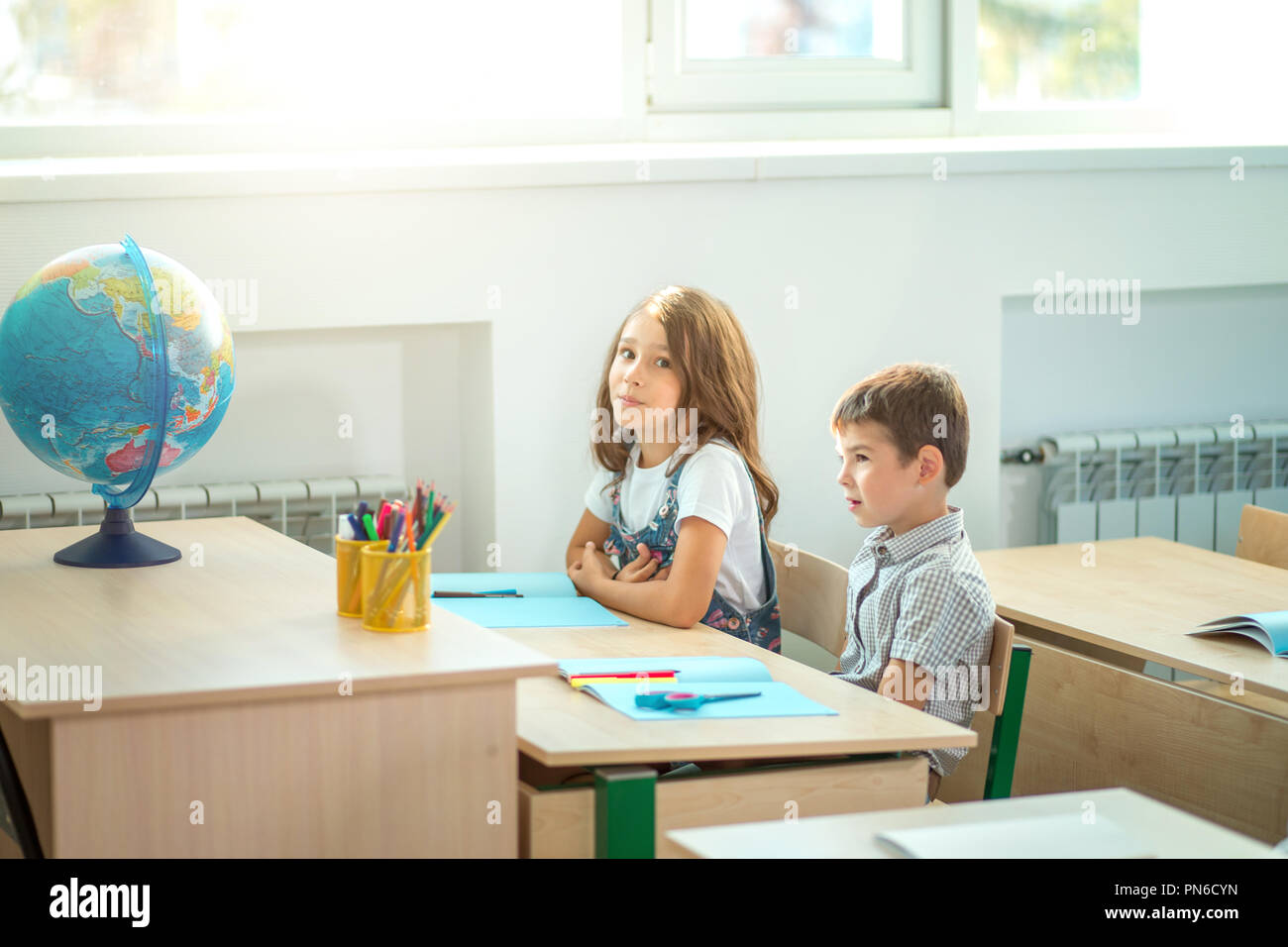 school children participating actively in class. Education, learning ...
