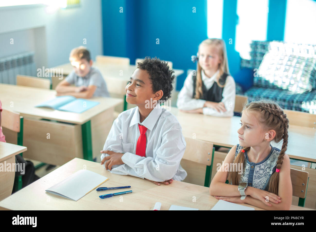 school children participating actively in class. Education, learning ...