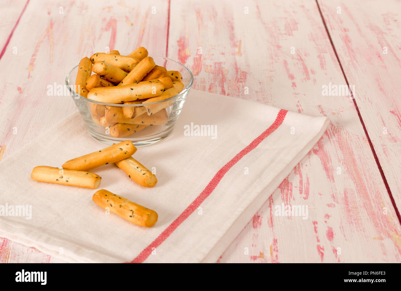 Small sized breadstick, grissini, ready to serve as appetizers on cloth ...