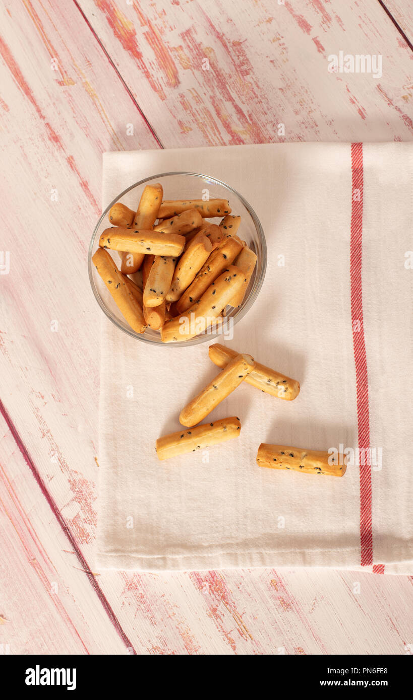 Small sized breadstick, grissini, ready to serve as appetizers on cloth ...