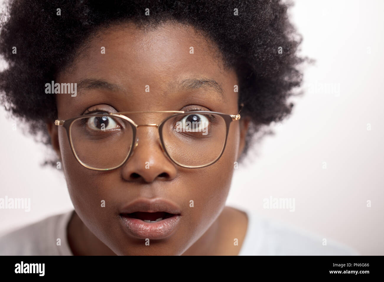 Surprised beautiful black woman with bugged eyes and opened mouth Stock ...