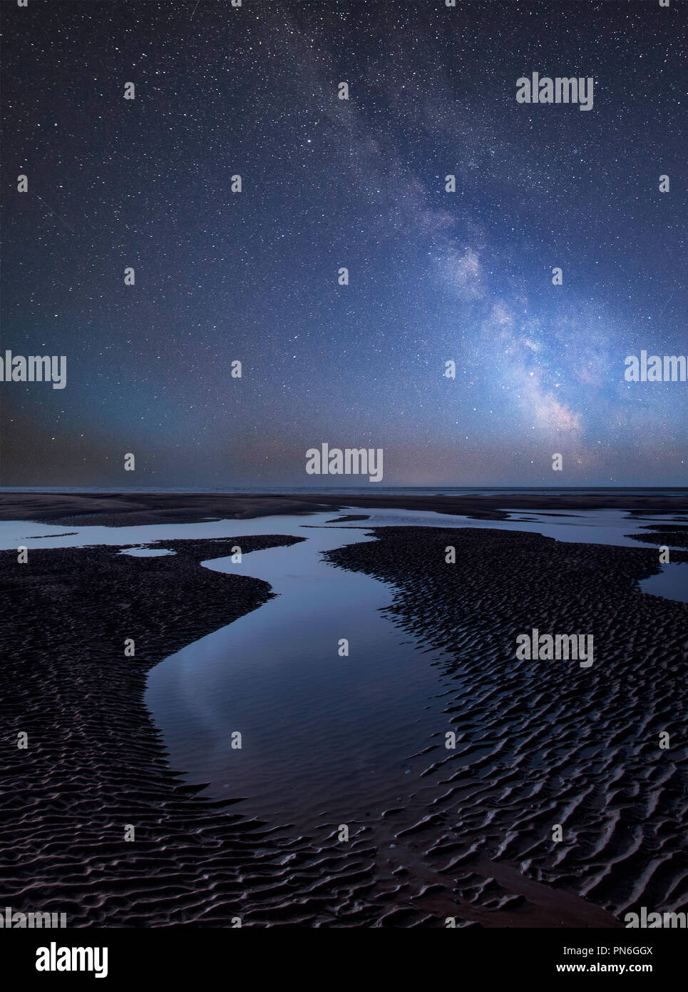 Stunning vibrant Milky Way composite image over landscape of Beautiful ...