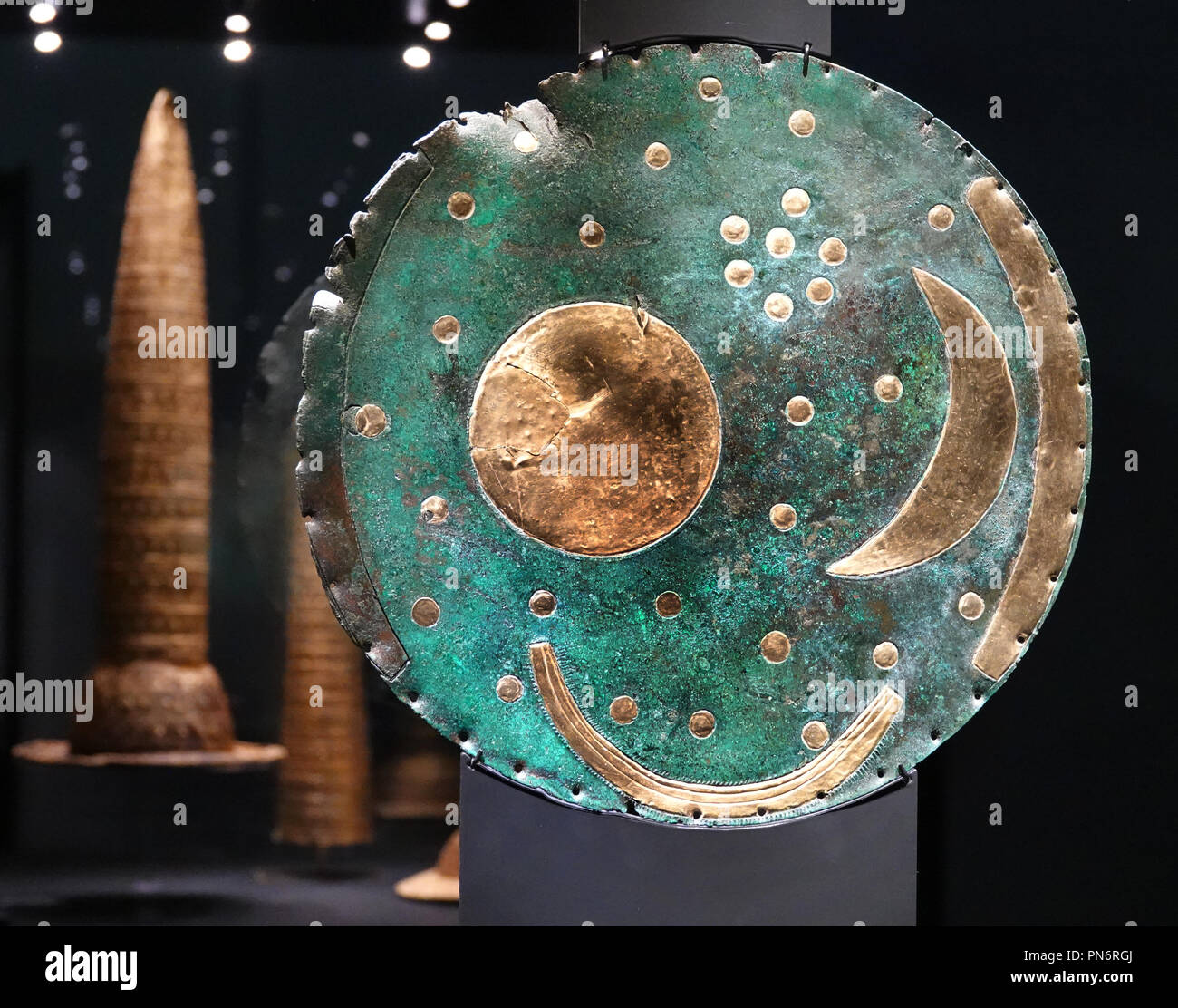 20 September 2018, Berlin: The Nebra Sky Disk stands in a glass display ...