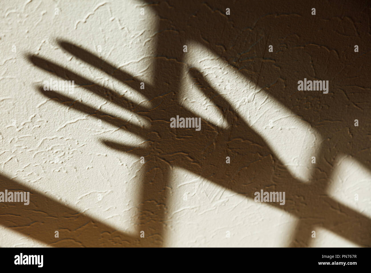 Hand shadow on wall hi-res stock photography and images - Alamy