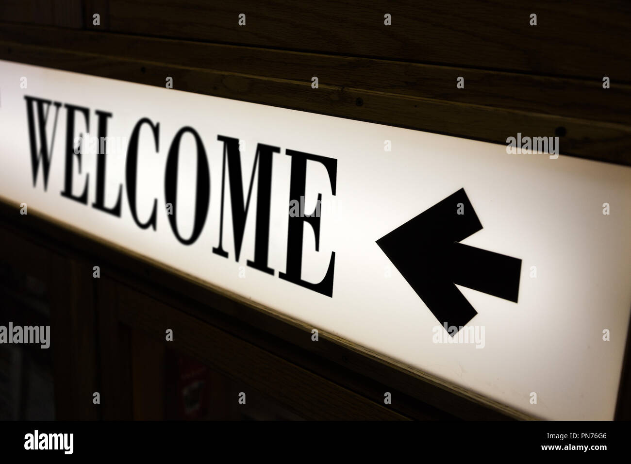 sign of word welcome and direction arrow Stock Photo - Alamy