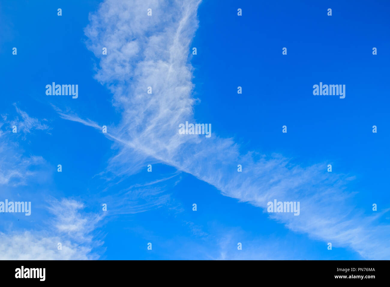Sparse clouds in the blue sky morning background. Fluffy clouds in the ...
