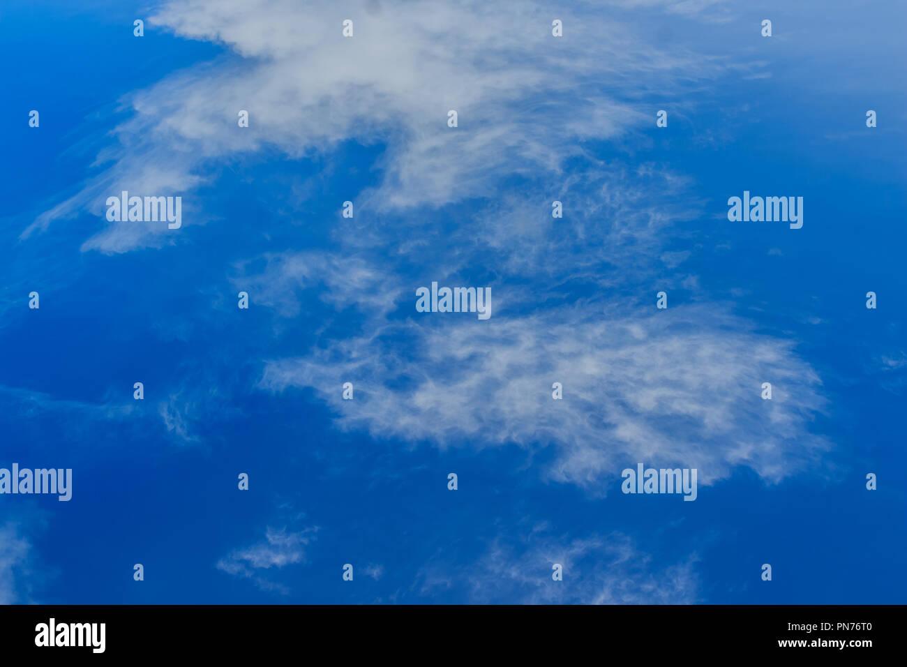Sparse clouds in the blue sky morning background. Fluffy clouds in the ...