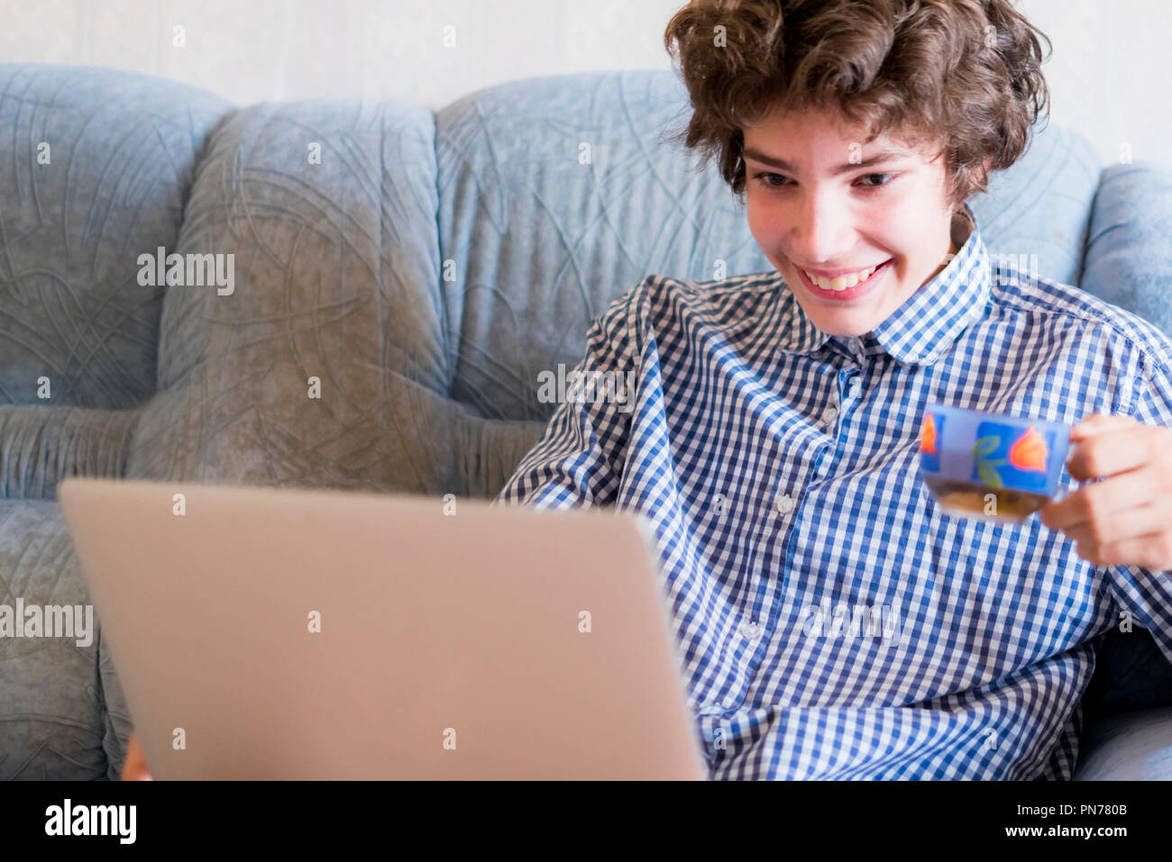 happy smiling young emotional teenager man with happy feelings working ...