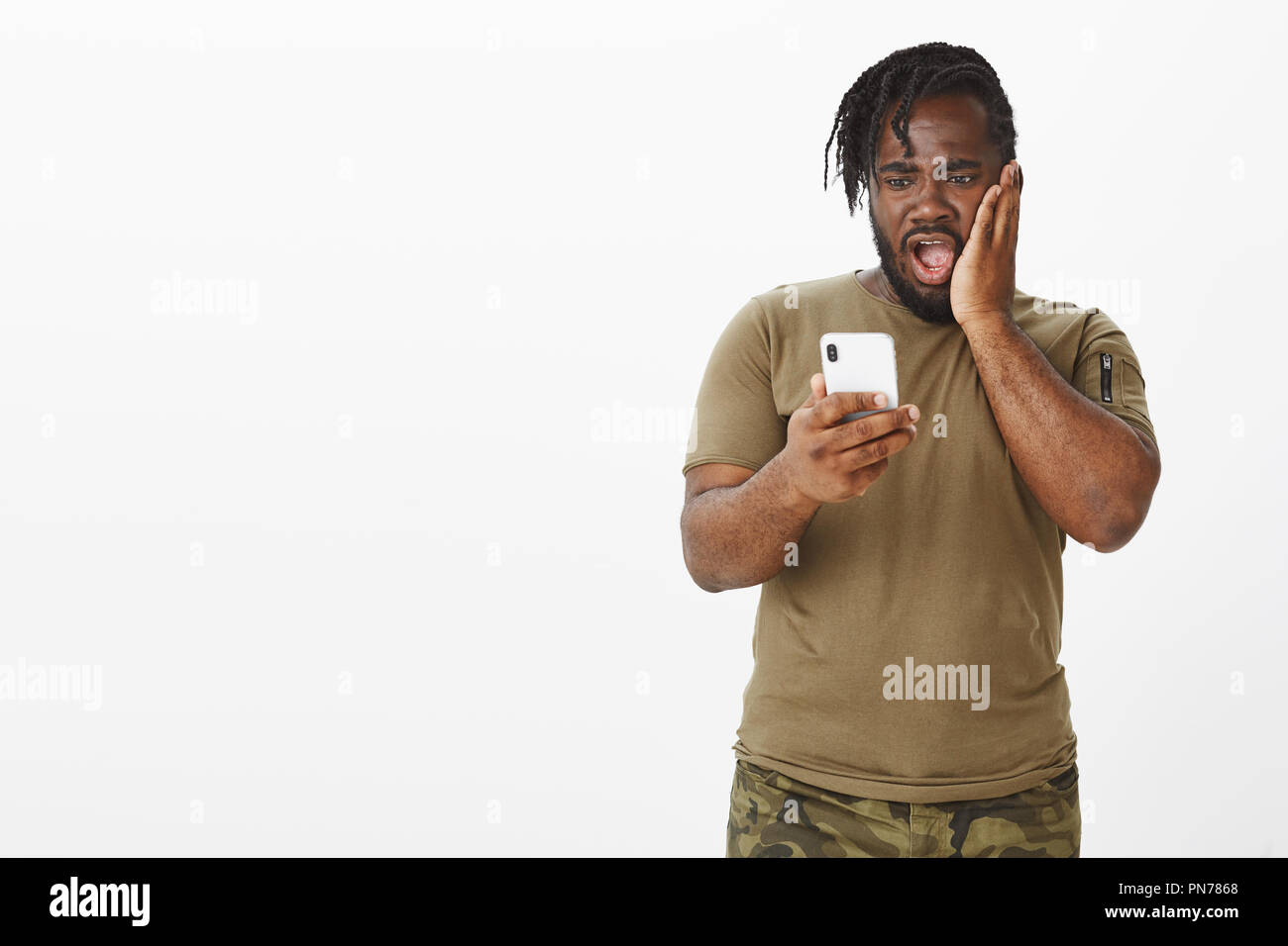Fat man shocked phone hi-res stock photography and images - Alamy