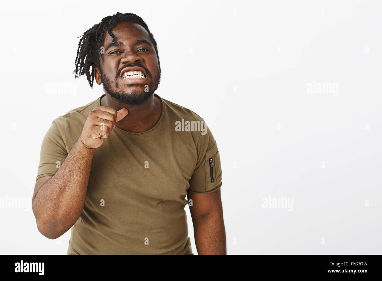 Pissed off guy gonna kill enemies. Outraged scary dark-skinned male in ...