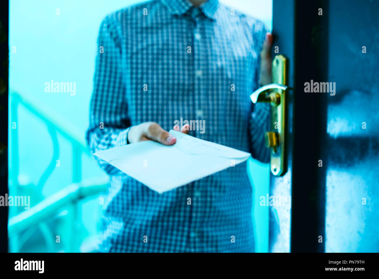 young postman brings the letter envelope delivery to home Stock Photo ...