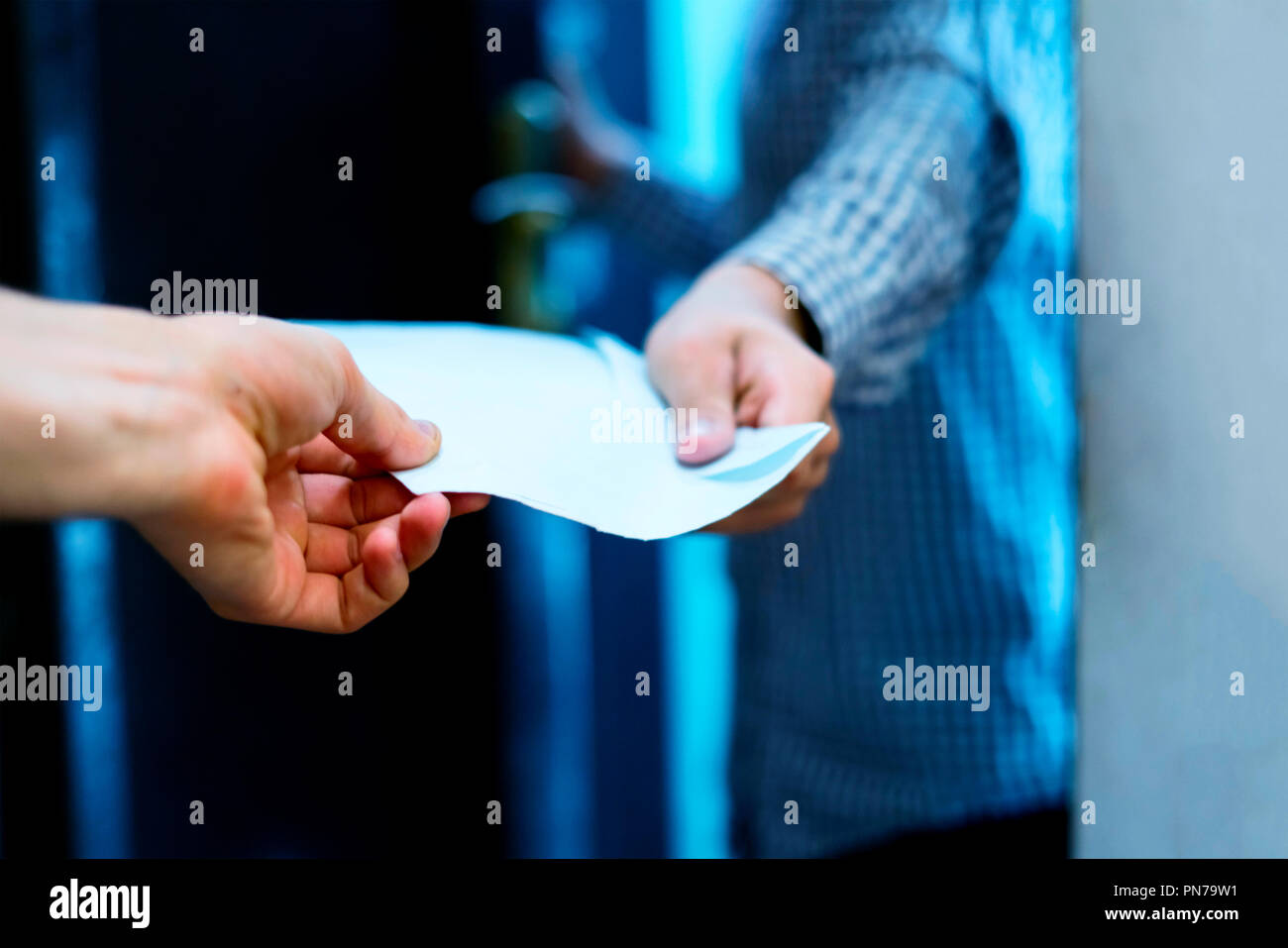 young postman brings the letter envelope delivery to home Stock Photo ...