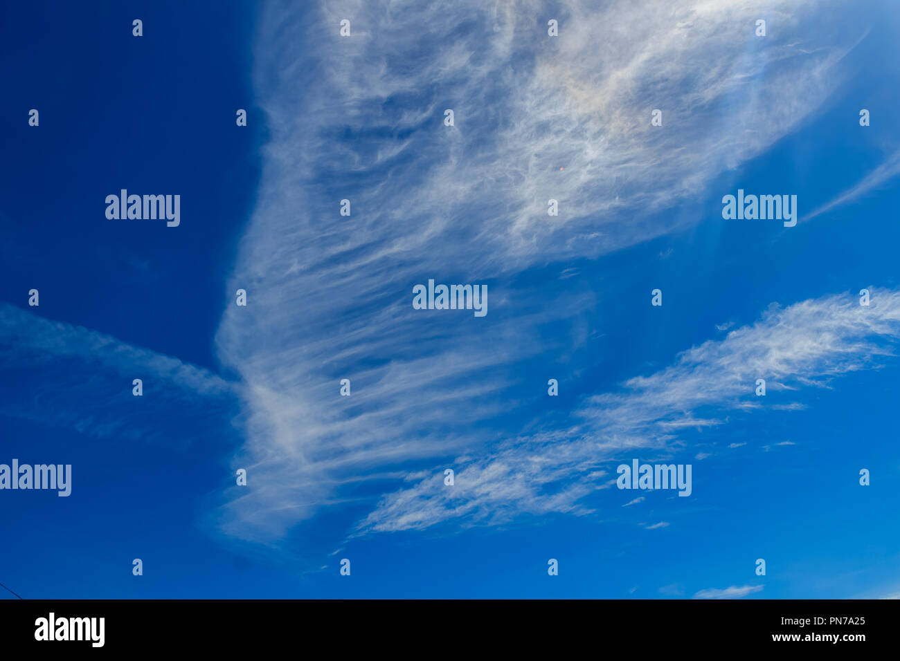 Sparse clouds in the blue sky morning background. Fluffy clouds in the ...