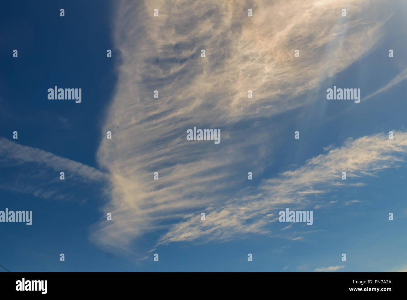 Sparse clouds in the blue sky morning background. Fluffy clouds in the ...