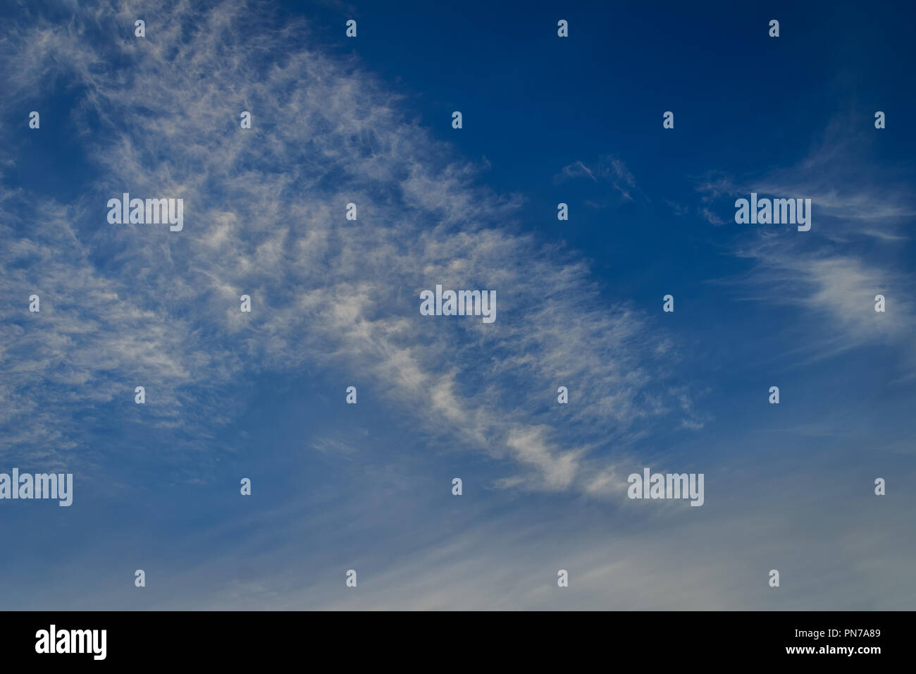 Sparse clouds in the blue sky morning background. Fluffy clouds in the ...