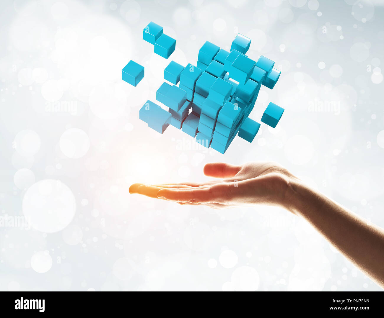 Cube color figure in male palm as symbol for integration. 3D rendering ...