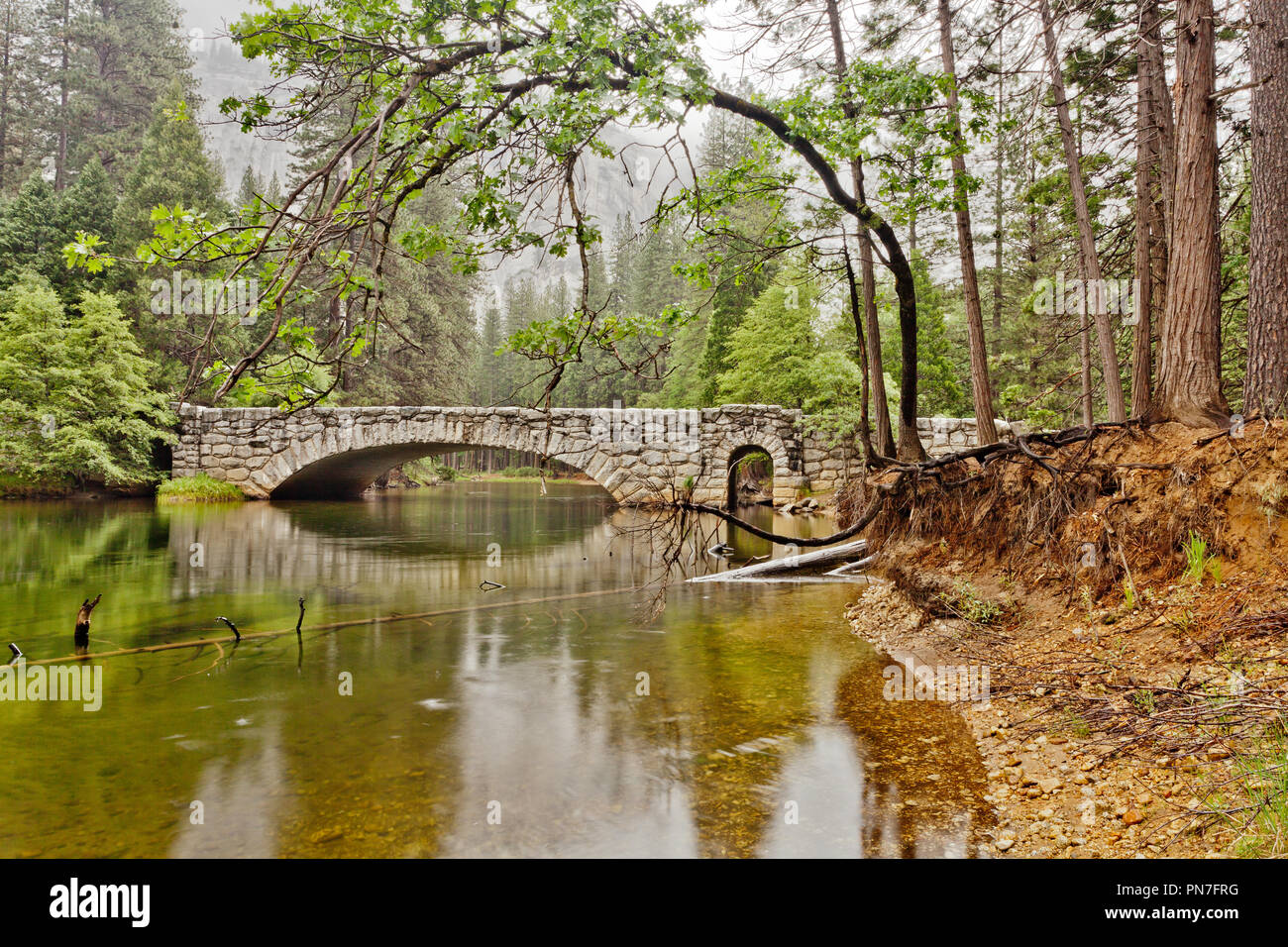 Stone bridge over Merced River in Yosemite National Park Stock Photo ...