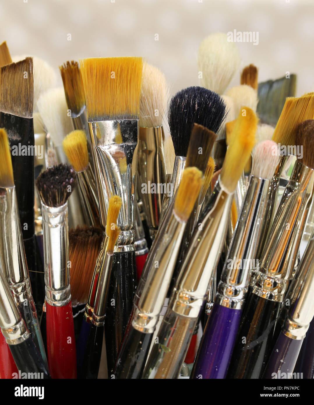 old brushes used several times by a painter Stock Photo - Alamy