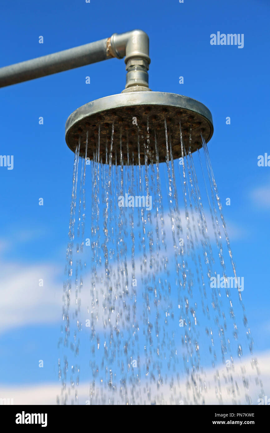 big shower with water to wash and the blue sky background Stock Photo ...