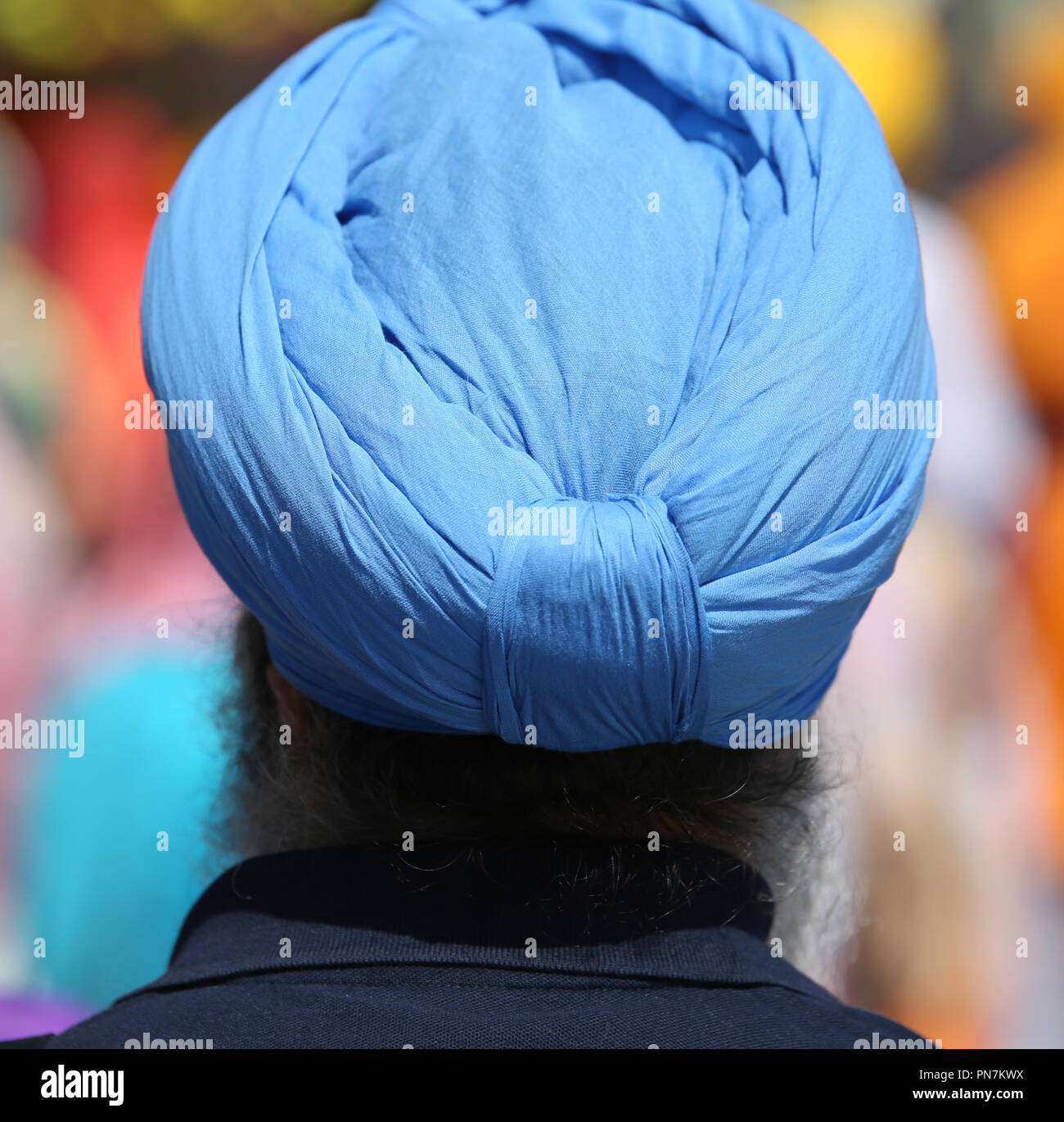 sikh man with blue turban during a religious ceremony Stock Photo - Alamy