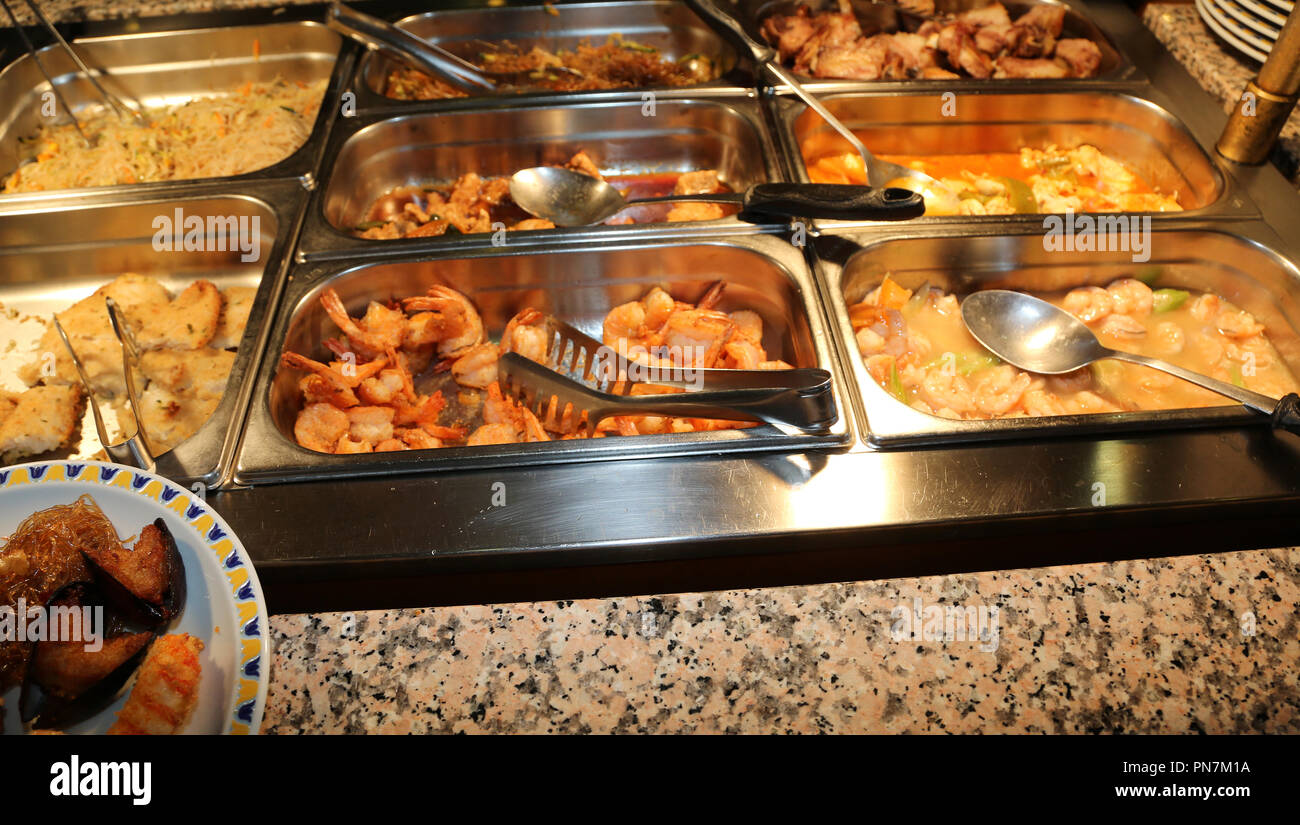 many trays with fried food in a self service Chinese restaurant Stock ...