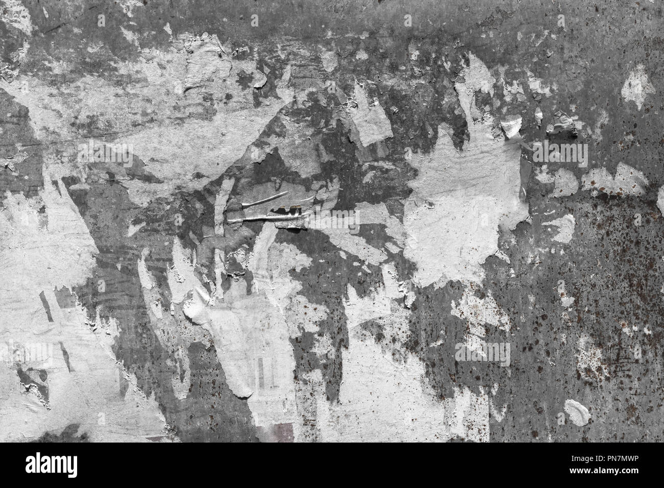 Texture of torn advertisement on an old rusty billboard panel. Ideal ...