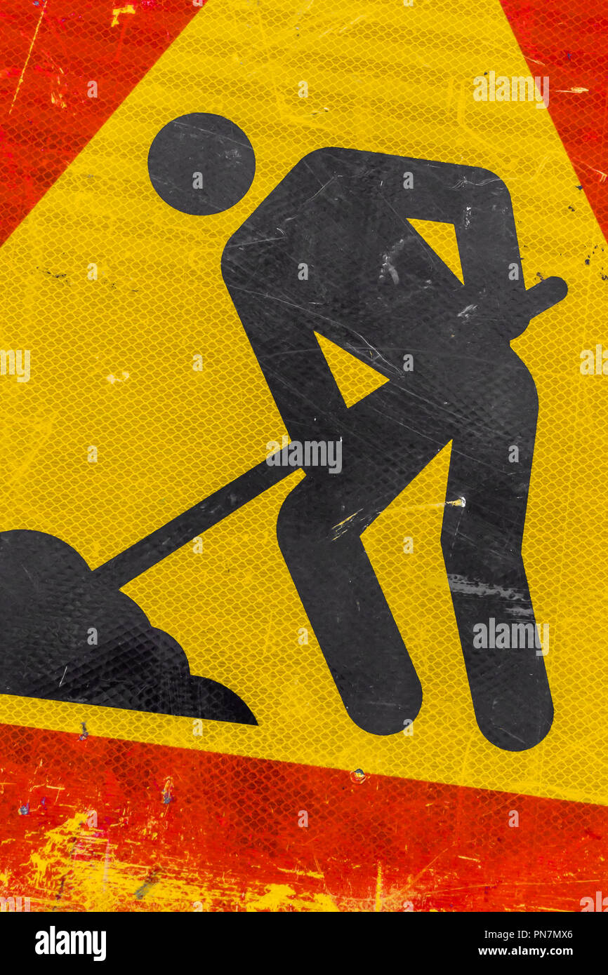 Close - up of road under construction traffic sign. Warning sign road ...