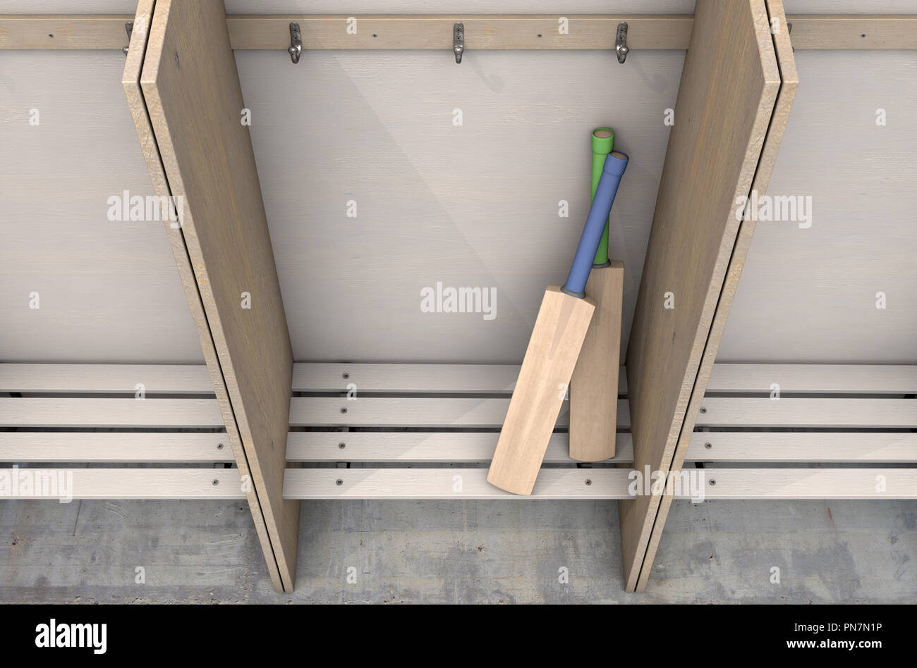Two cricket bats in a wooden cubicle with a bench and hangers in a ...