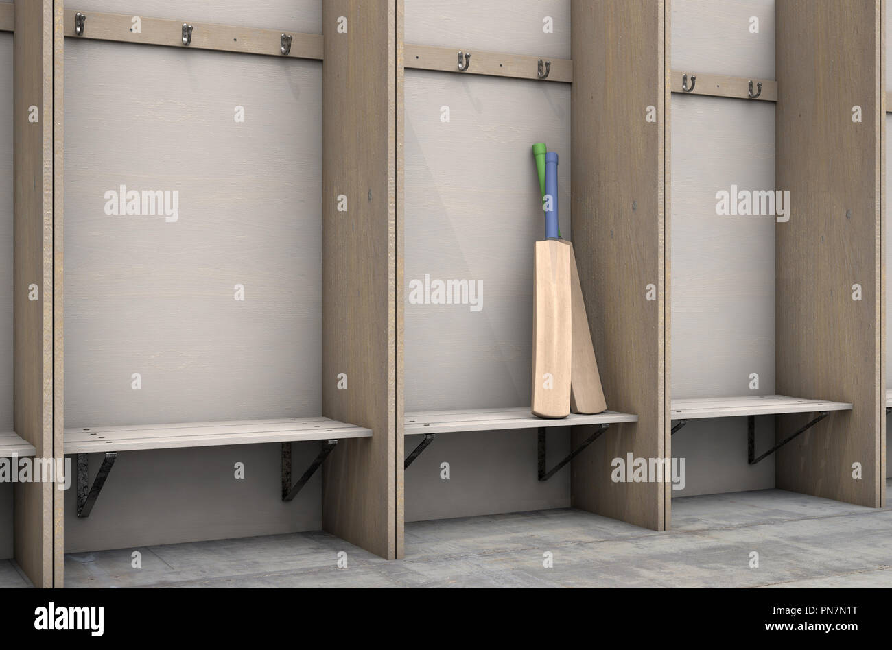 Two cricket bats in a wooden cubicle with a bench and hangers in a ...