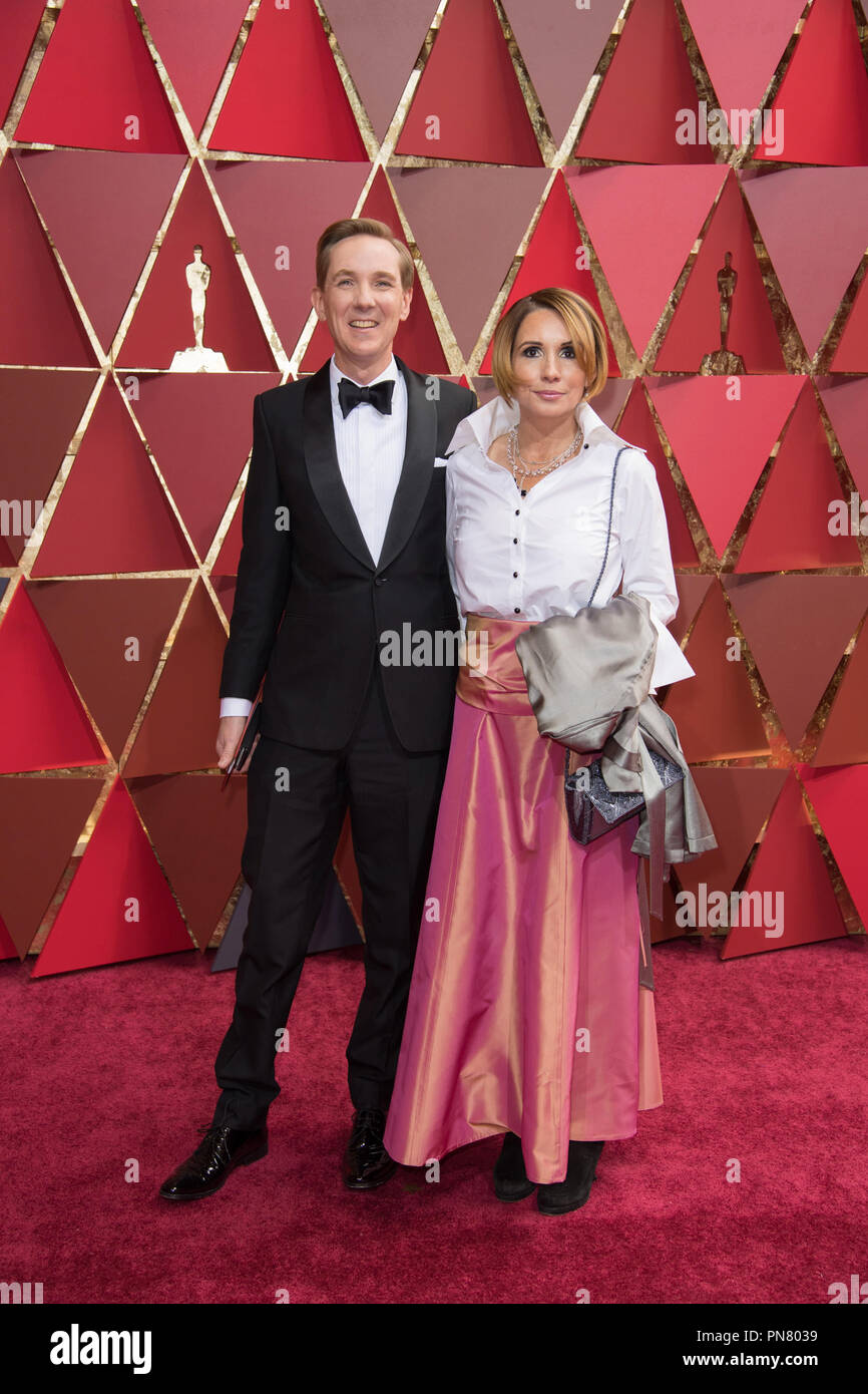 Robert Mackenzie and guest arrive on the red carpet of The 89th Oscars ...