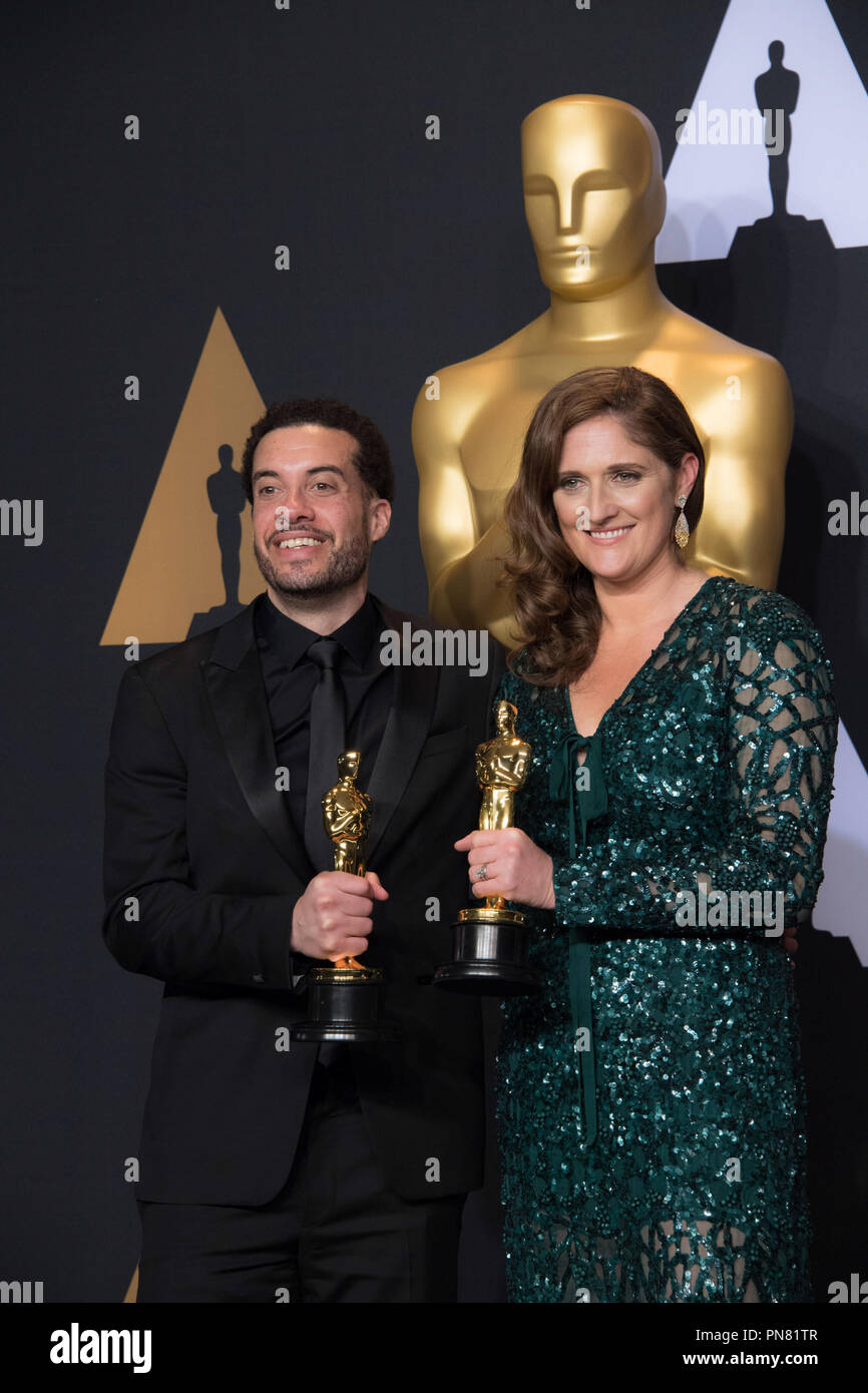 Ezra Edelman and Caroline Waterlow pose backstage with the Oscar® for ...