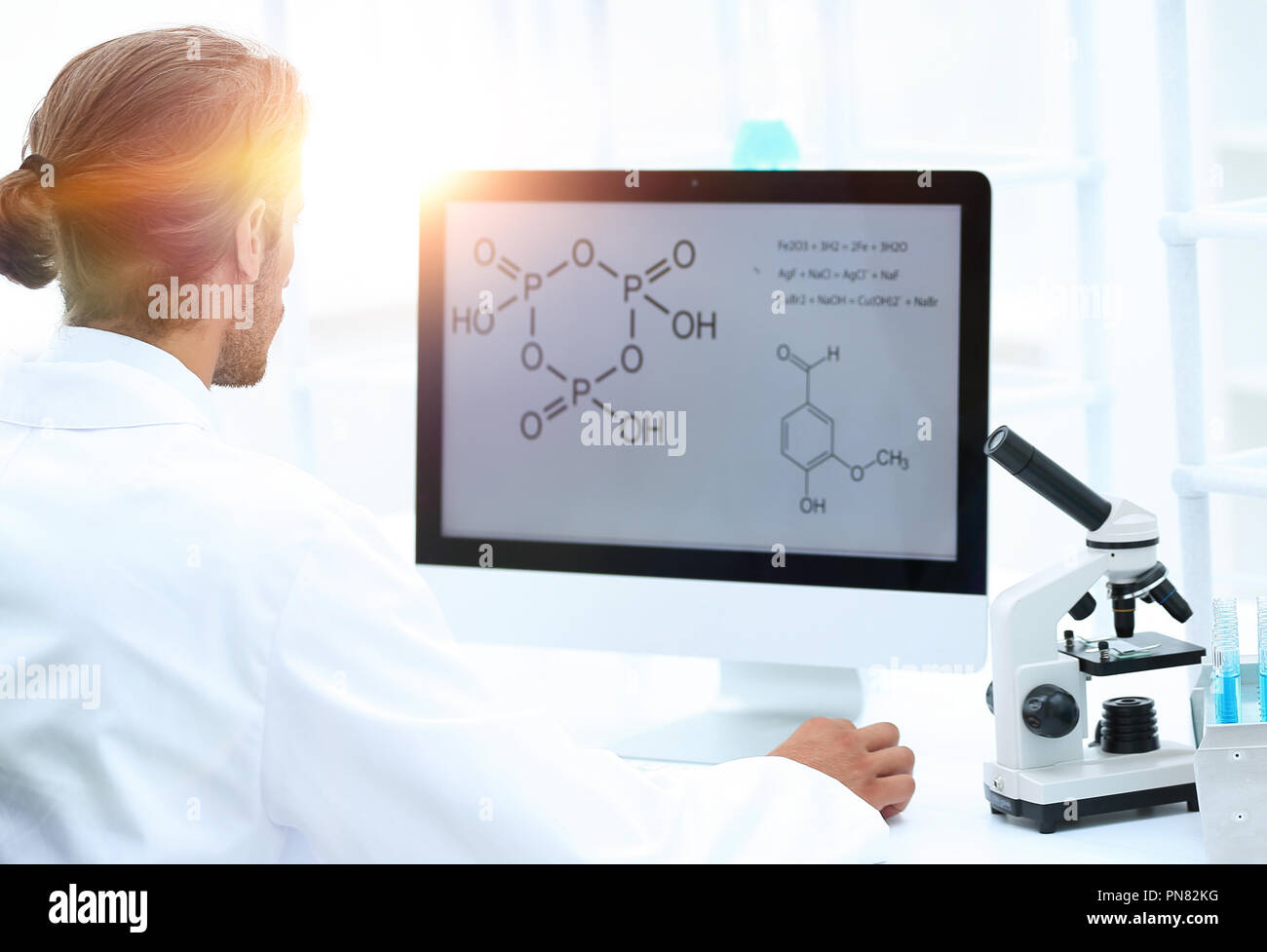 research scientist using computer chemistry laboratory Stock Photo - Alamy