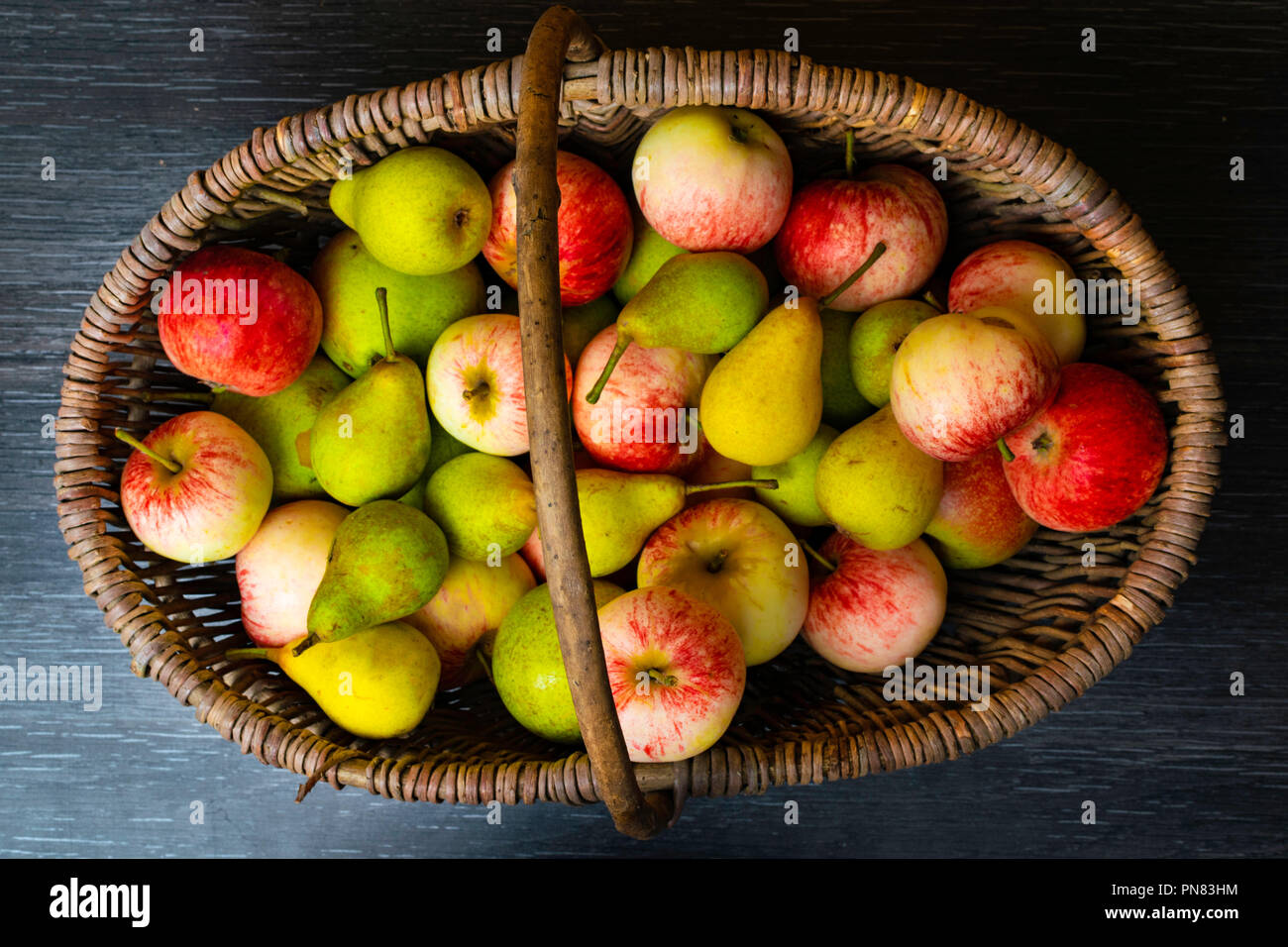 basket of ecological and imperfect apples and pears, health vitamin ...