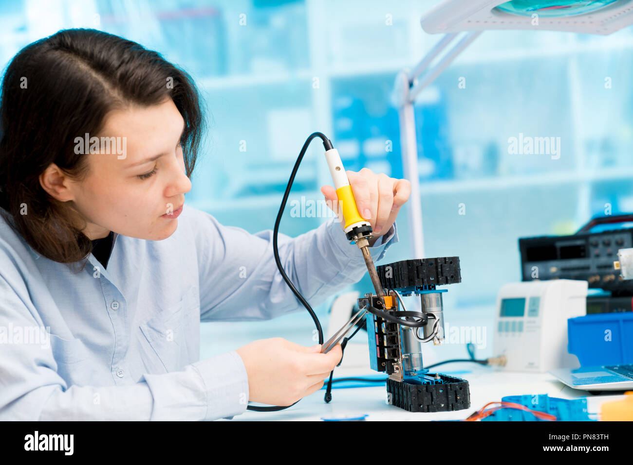 Young woman in CNC and robotics laboratory Stock Photo - Alamy