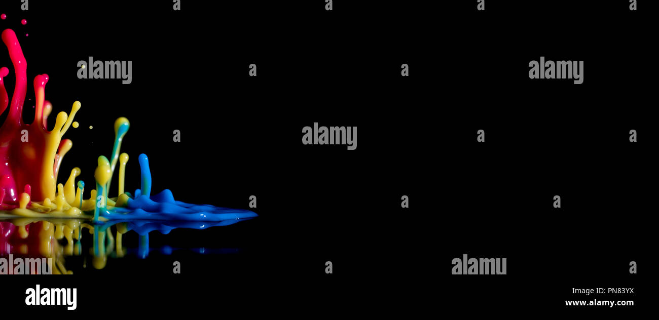 Abstract sculptures of colorful splashes of paint. Dancing liquid on a ...