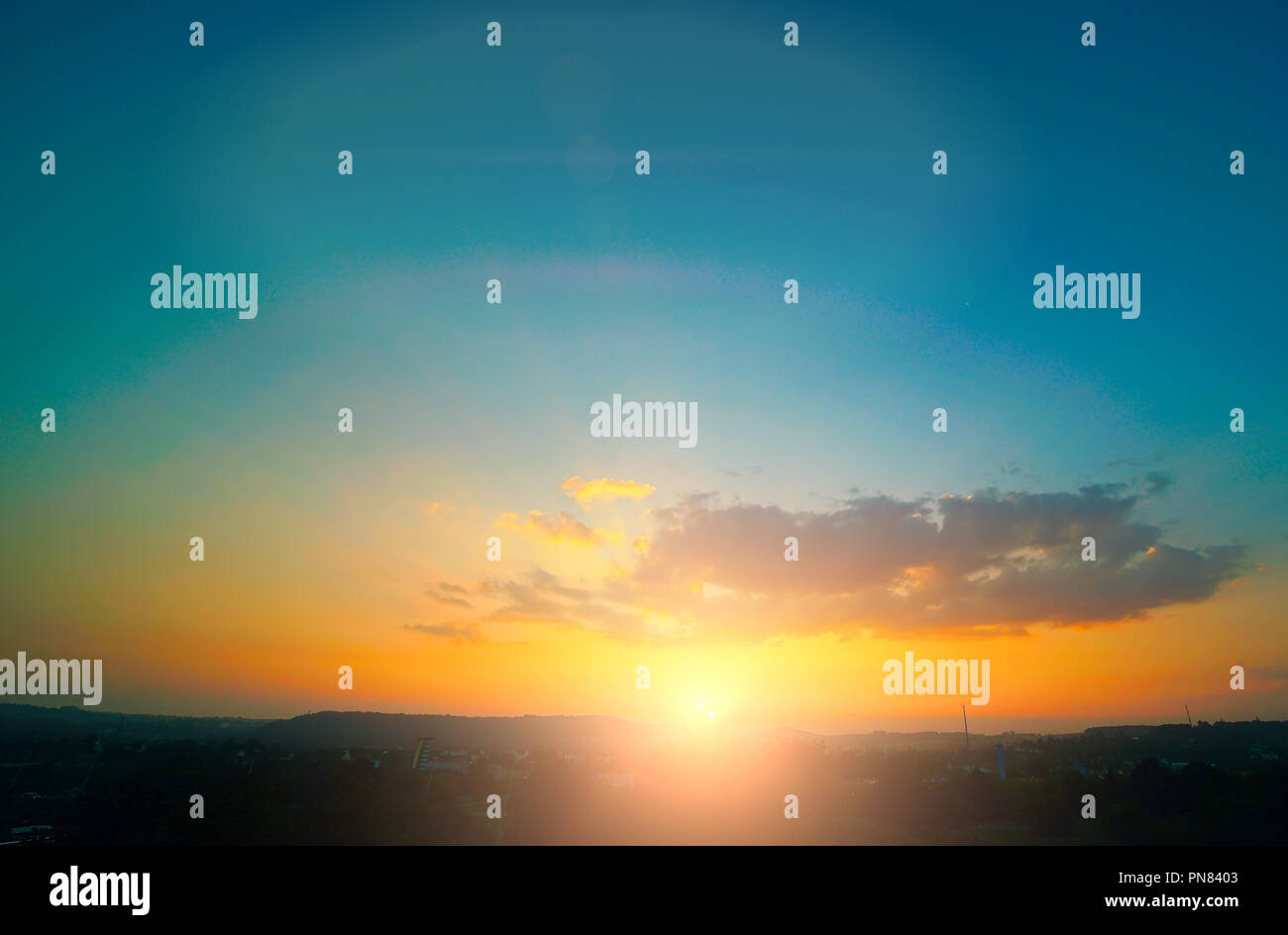 Beautiful sunset sky above clouds with dramatic light Stock Photo - Alamy