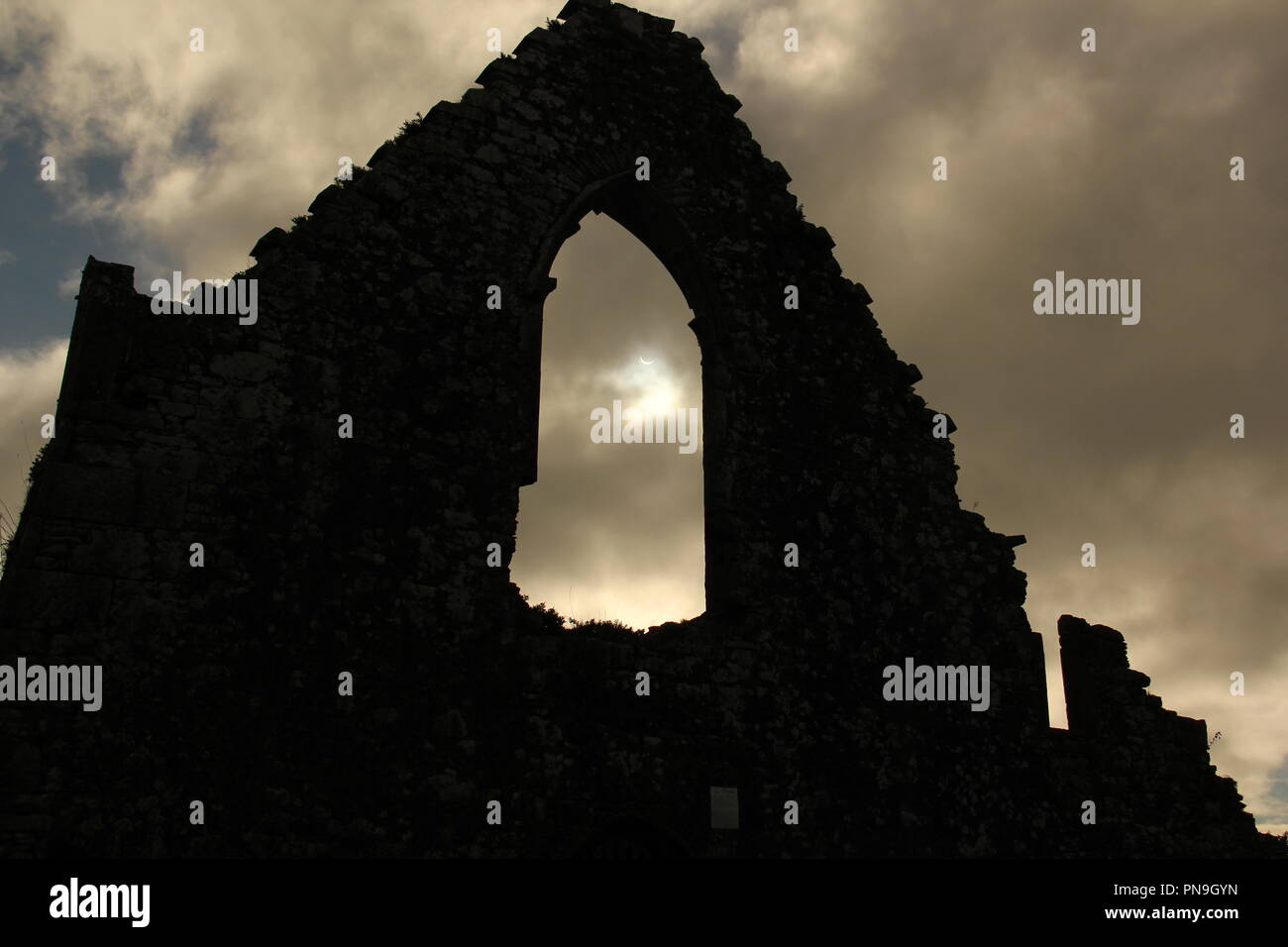 Solar eclipse (near-total) seen through Abbey window Stock Photo - Alamy