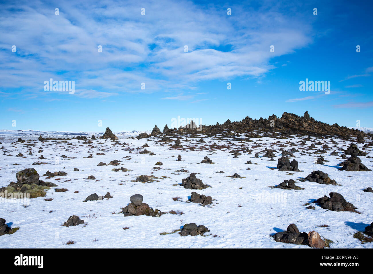 Lauskalavarda, a lava ridge with stone cairns and volcanic lava mounds ...
