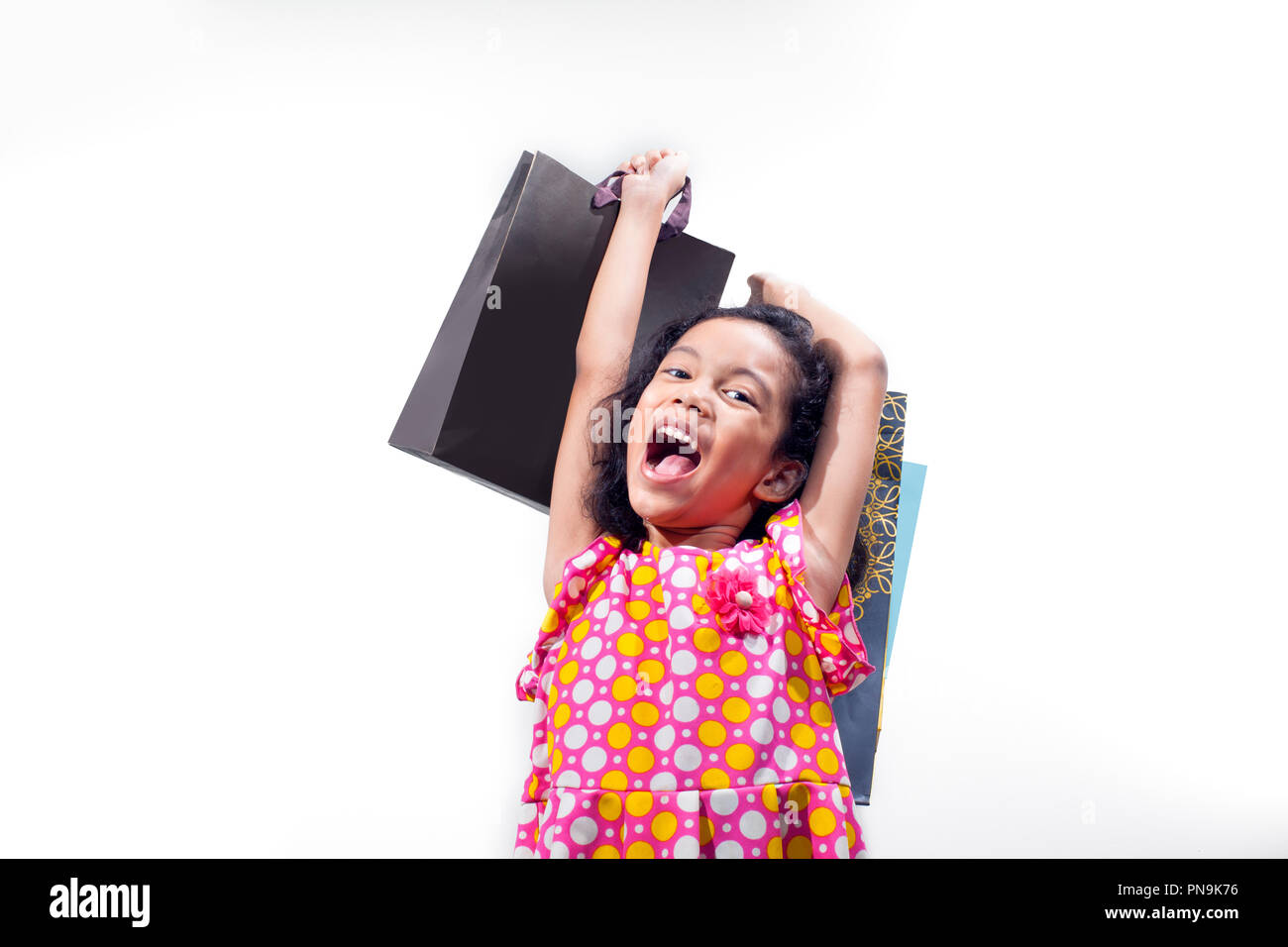 Shopping girl showing happy expression Stock Photo - Alamy