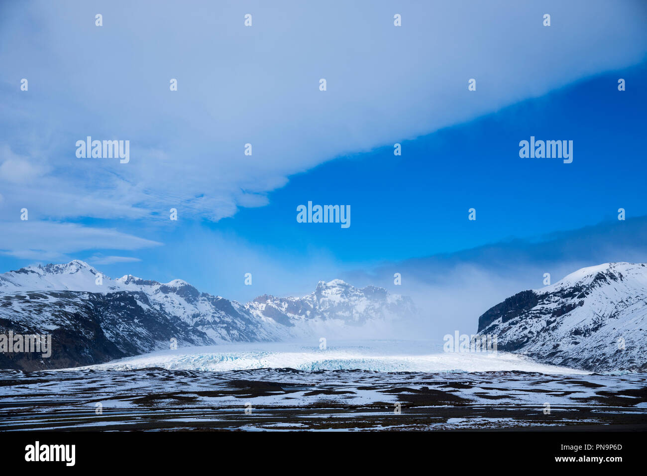 Blue sky over glacial tongue of Svinafellsjokull glacier an outlet ...