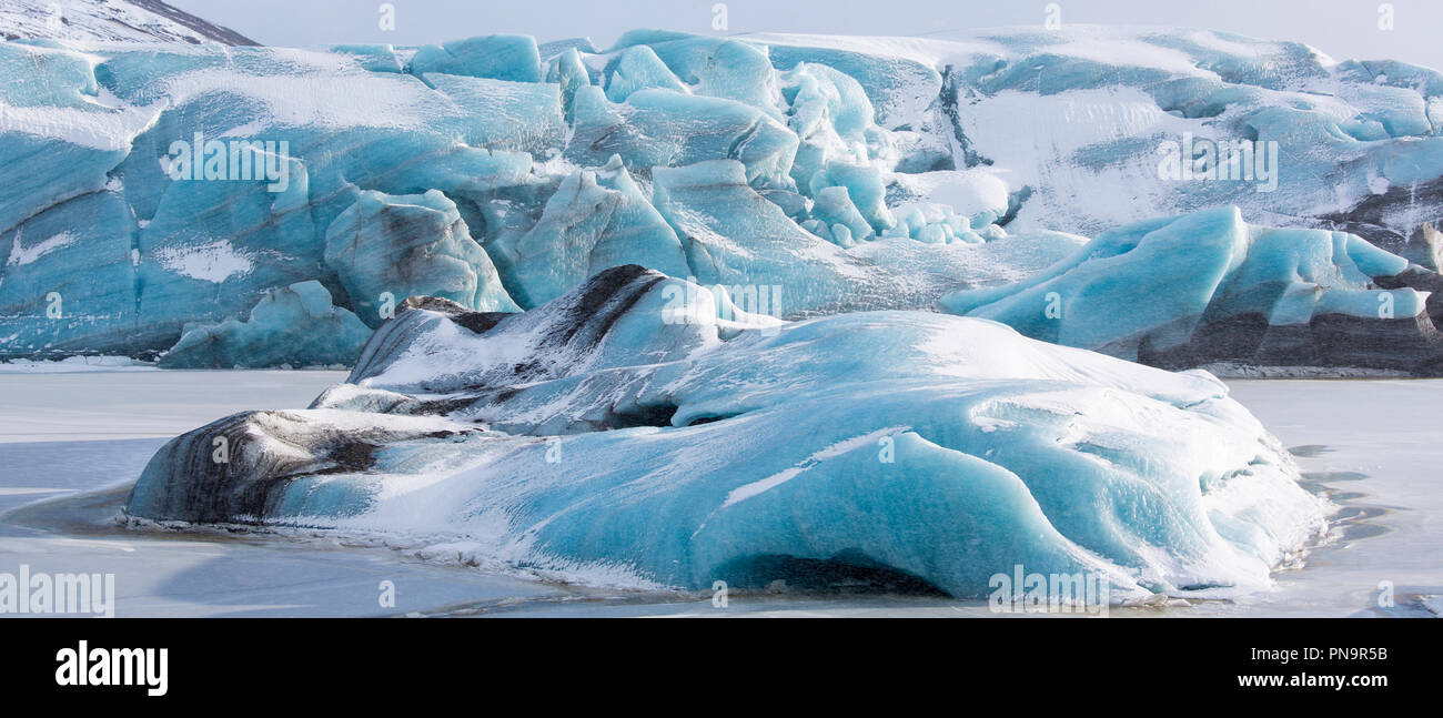 Close up showing layers in ice blocks of glacial tongue of ...