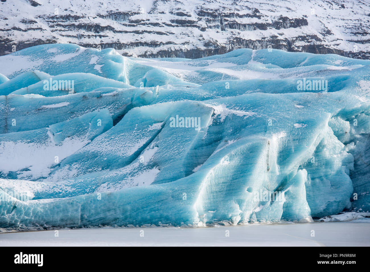 Close up showing layers in ice blocks of glacial tongue of ...