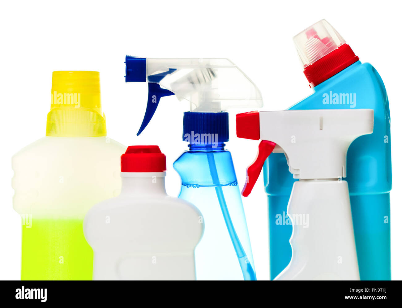 Cleaning supplies in a row on white background Stock Photo - Alamy