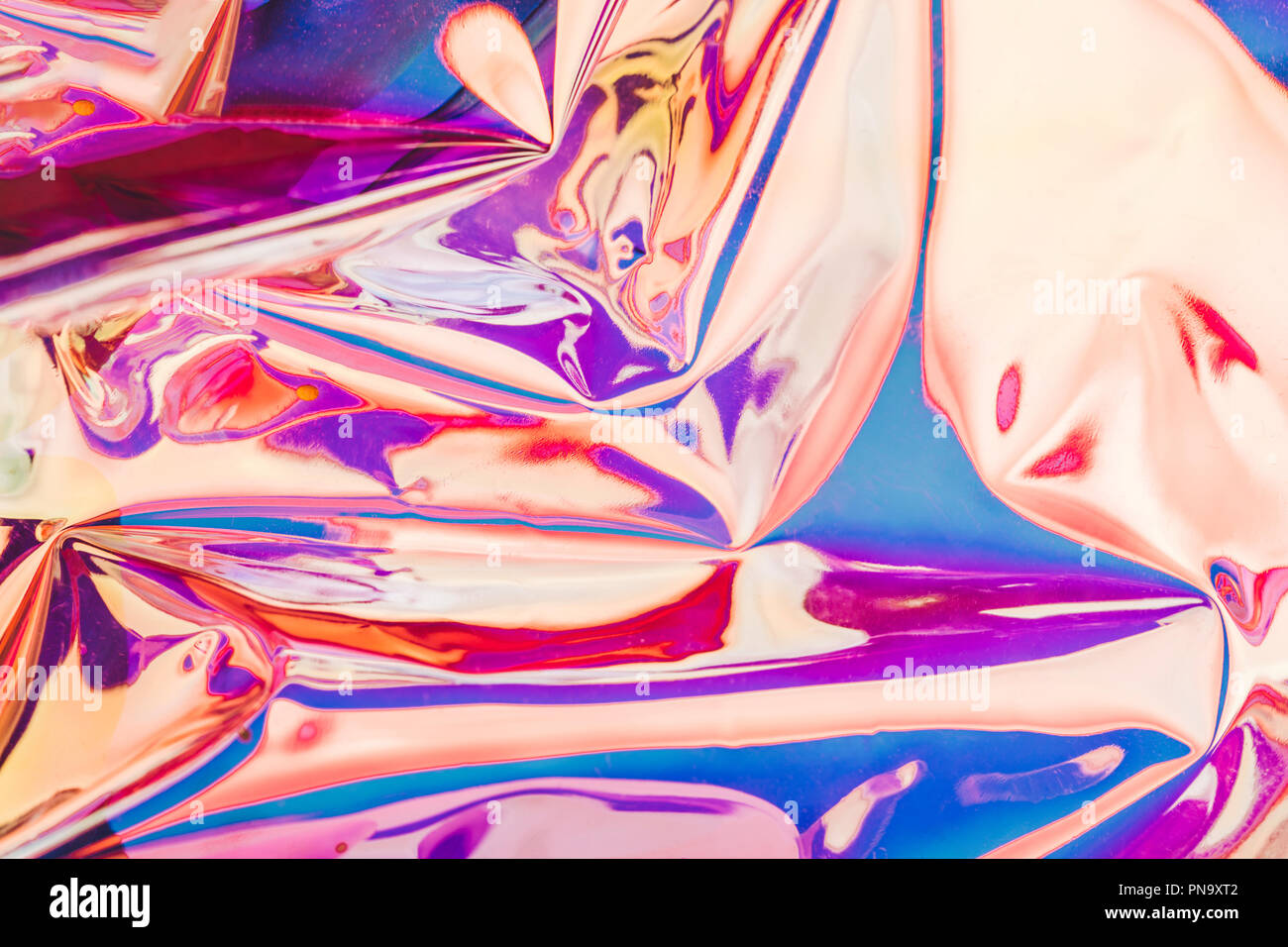 Bright holographic foil background Stock Photo - Alamy