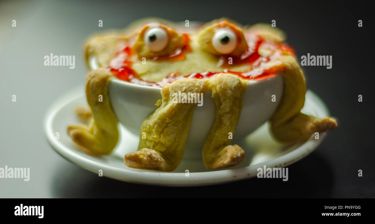 cake baked in the shape of a monster in a ceramic bowl, sweet for ...