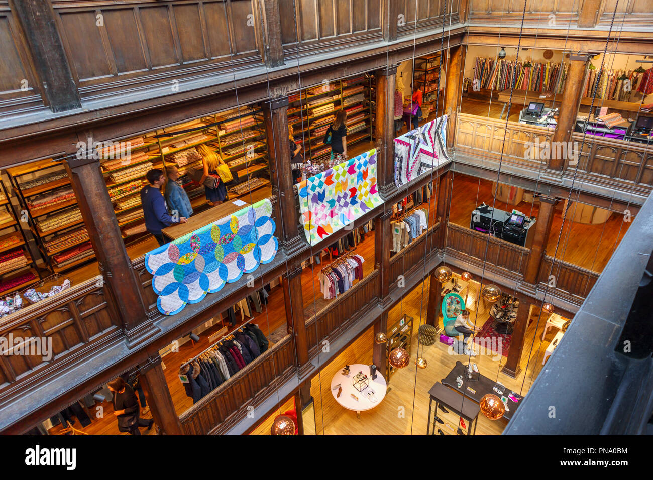 Galleried interior of Liberty of London department store with colourful ...