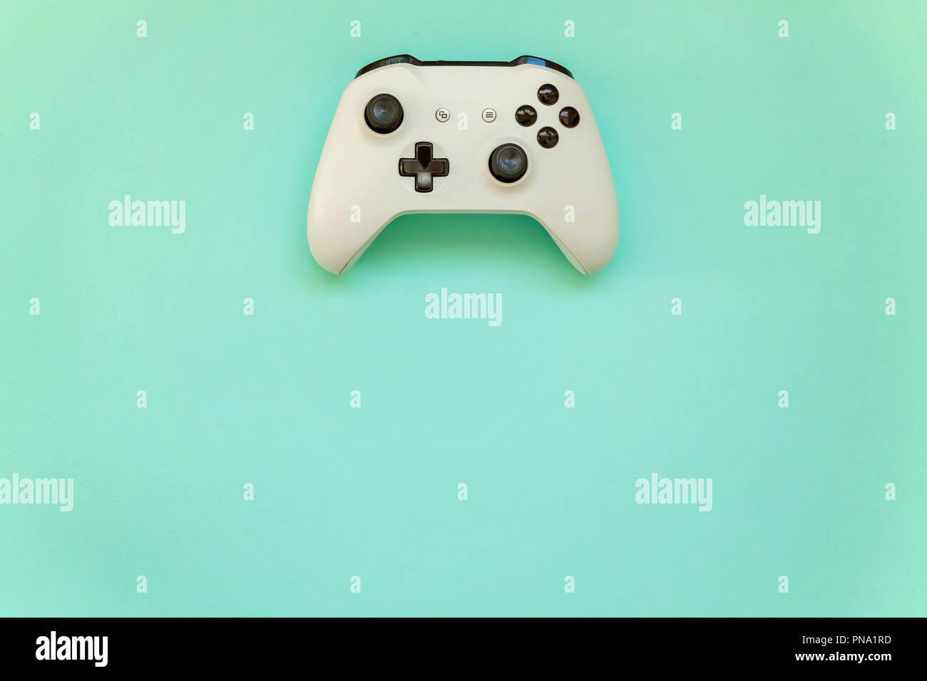 White joystick gamepad, game console on blue colourful trendy modern ...
