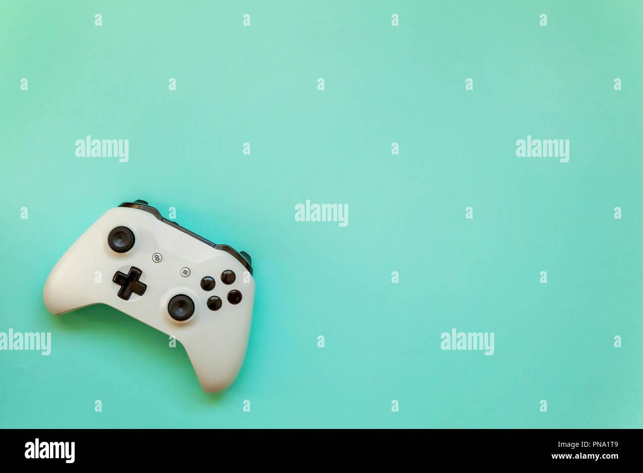White joystick gamepad, game console on blue colourful trendy modern ...